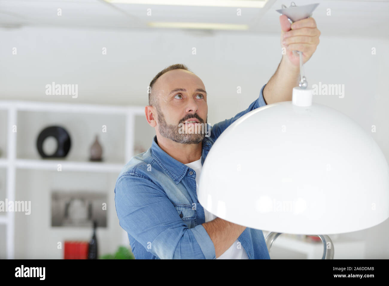 Man changing light bulb hi-res stock photography and images - Alamy