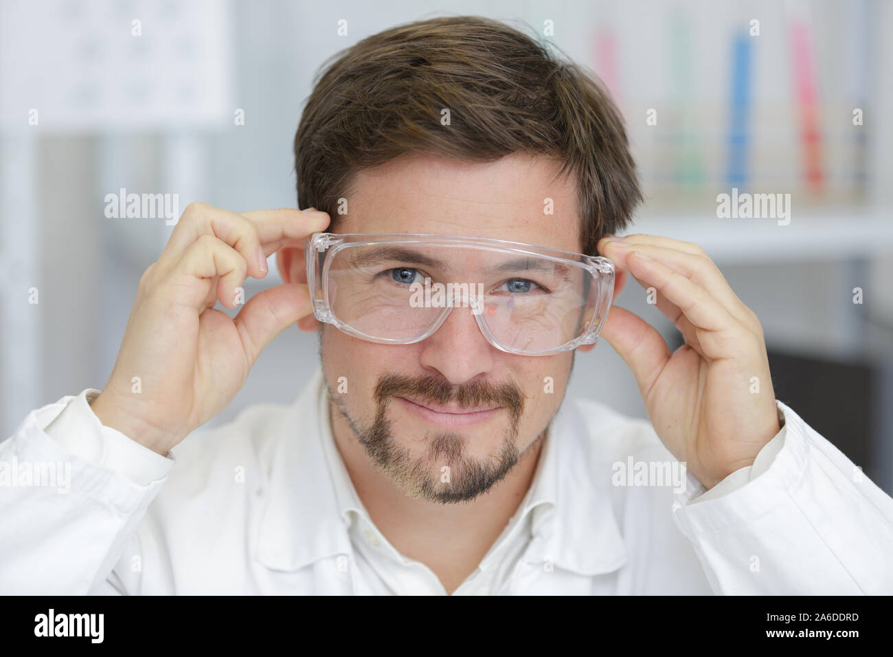 man wearing safety goggles in modern laboratory Stock Photo - Alamy