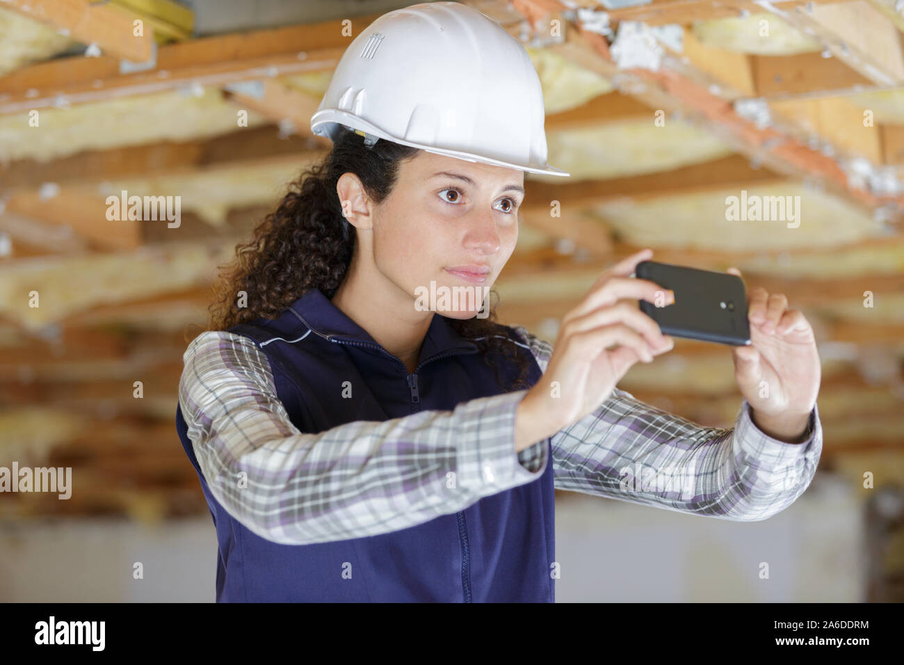 woman use mobile phone in construction work site Stock Photo - Alamy