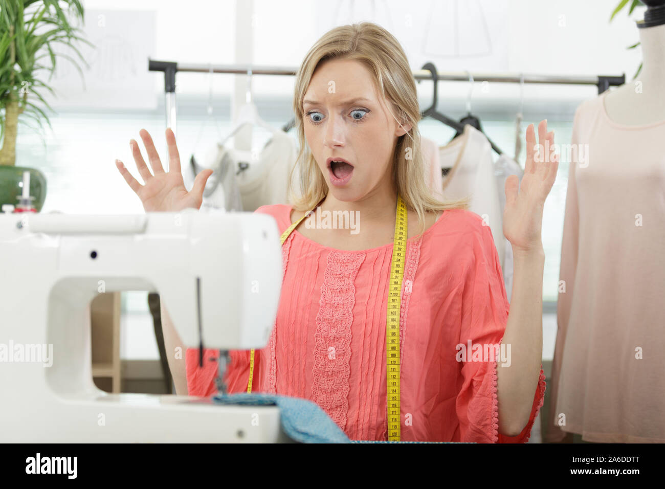 the woman was upset with sewing machine Stock Photo - Alamy