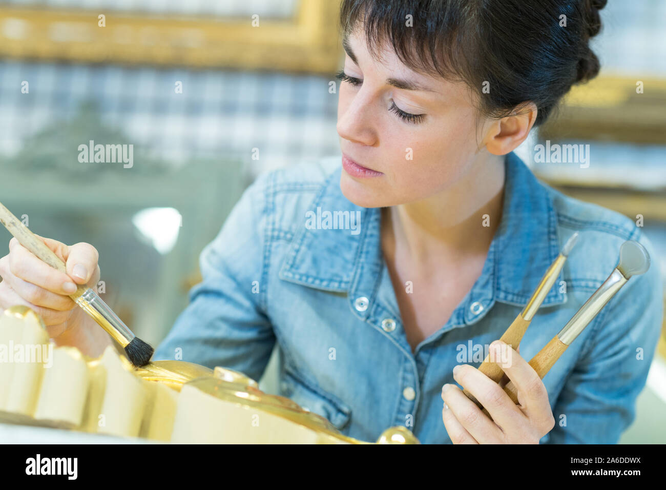 woman painting a frame Stock Photo - Alamy