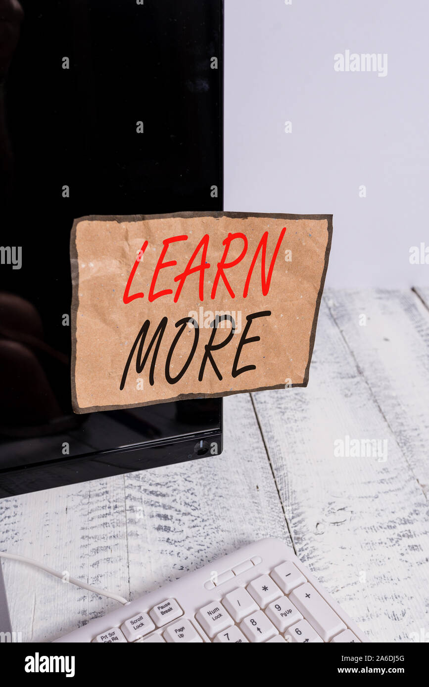 Writing note showing Learn More. Business concept for knowledge or ...