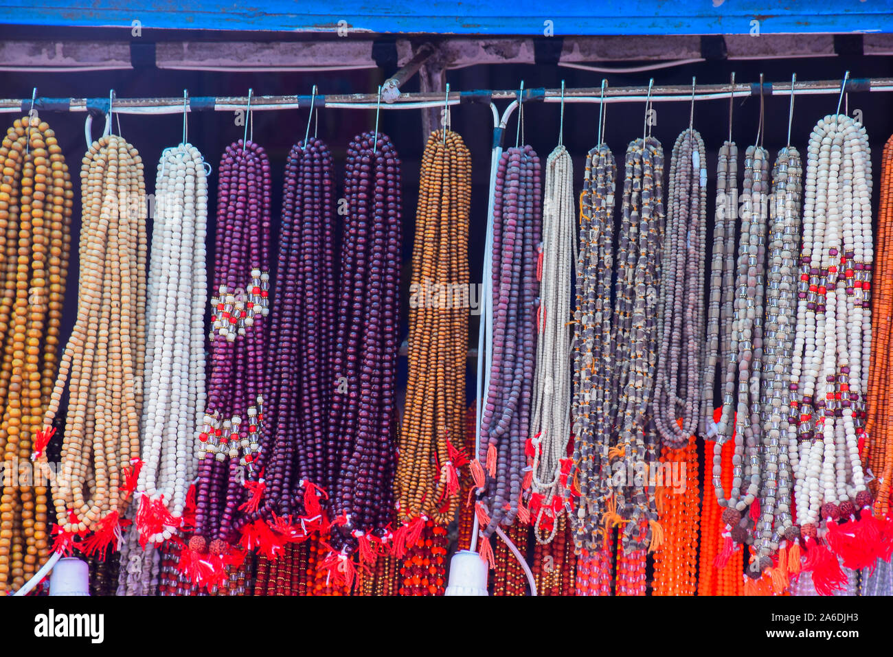 Colorful garlands hung at the shop, outside maa chamunda temple in ...
