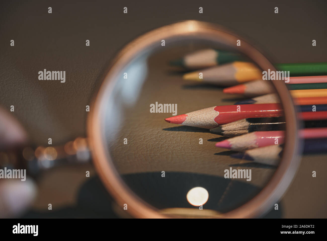 colorful drawing pencils; Color pencils under the magnifying glass ...