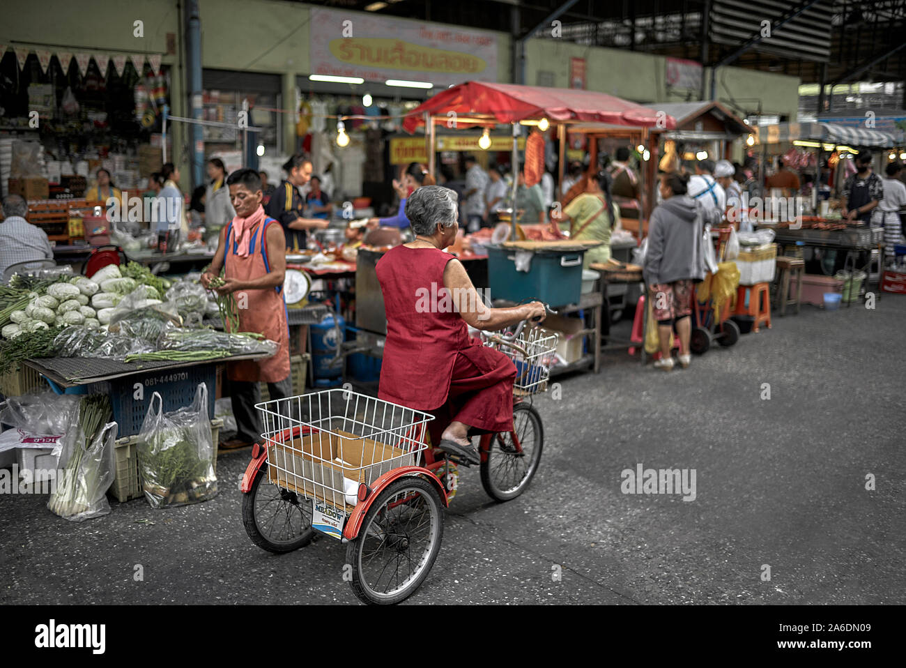 Woman riding tricycle hi-res stock photography and images - Alamy