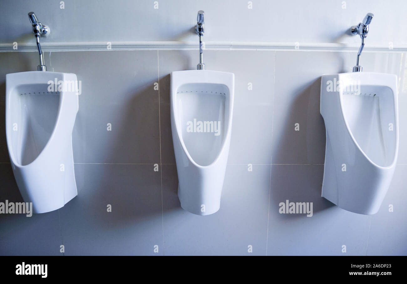 White urinals in the bathroom, modern toilet in hotel Stock Photo - Alamy