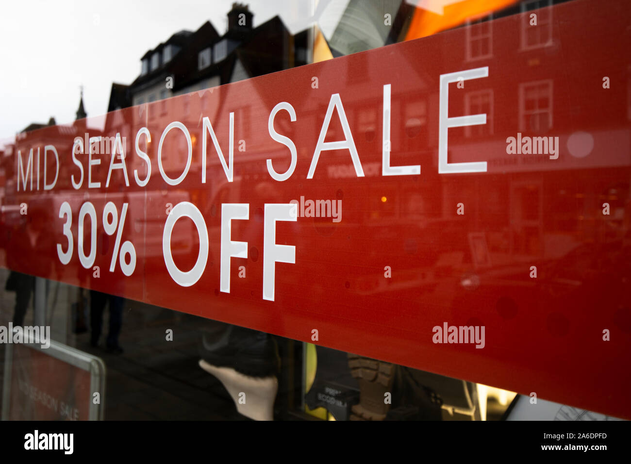thirty percent off sale sign in womenswear shop window highlighting the ...
