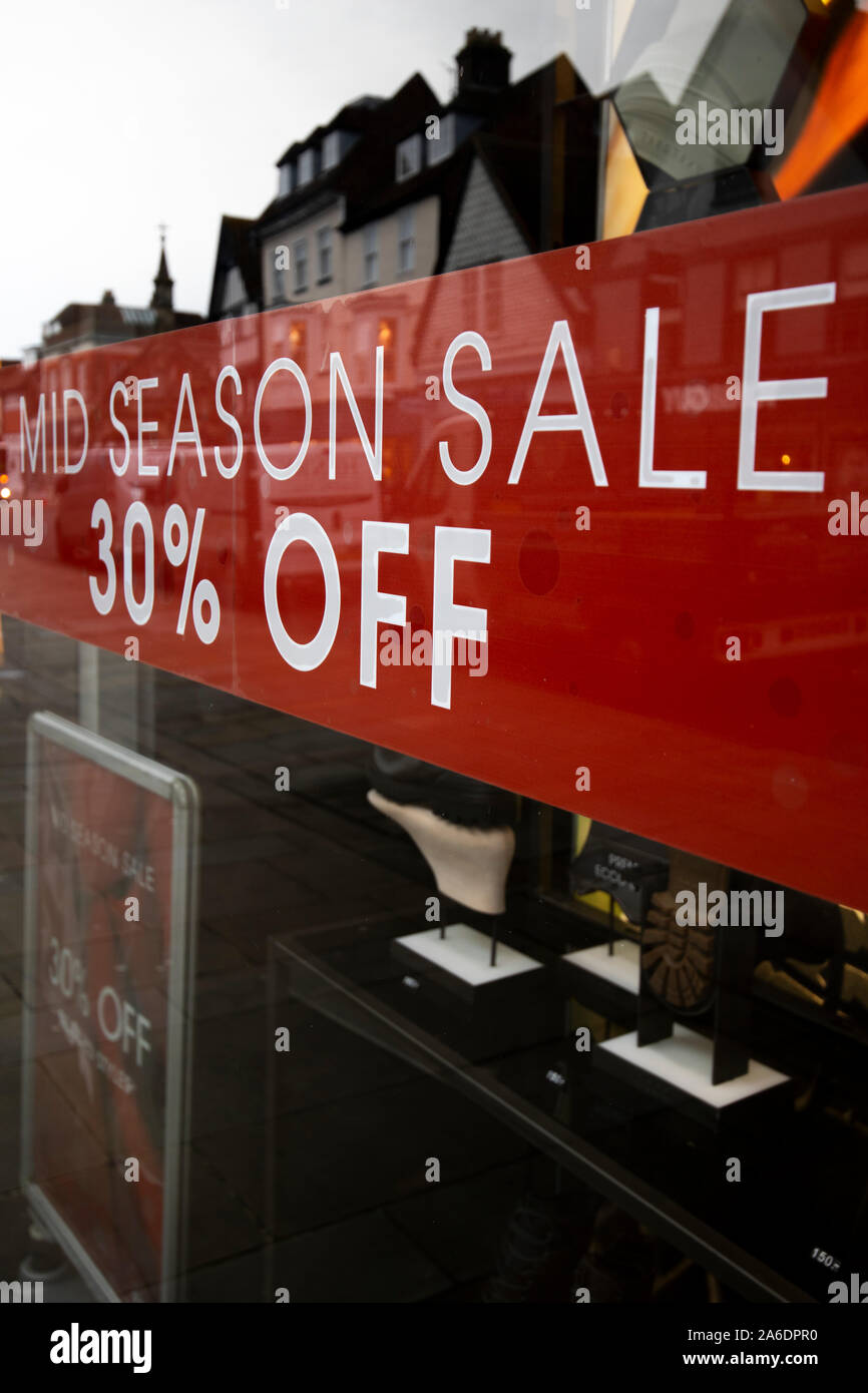thirty percent off sale sign in womenswear shop window highlighting the ...