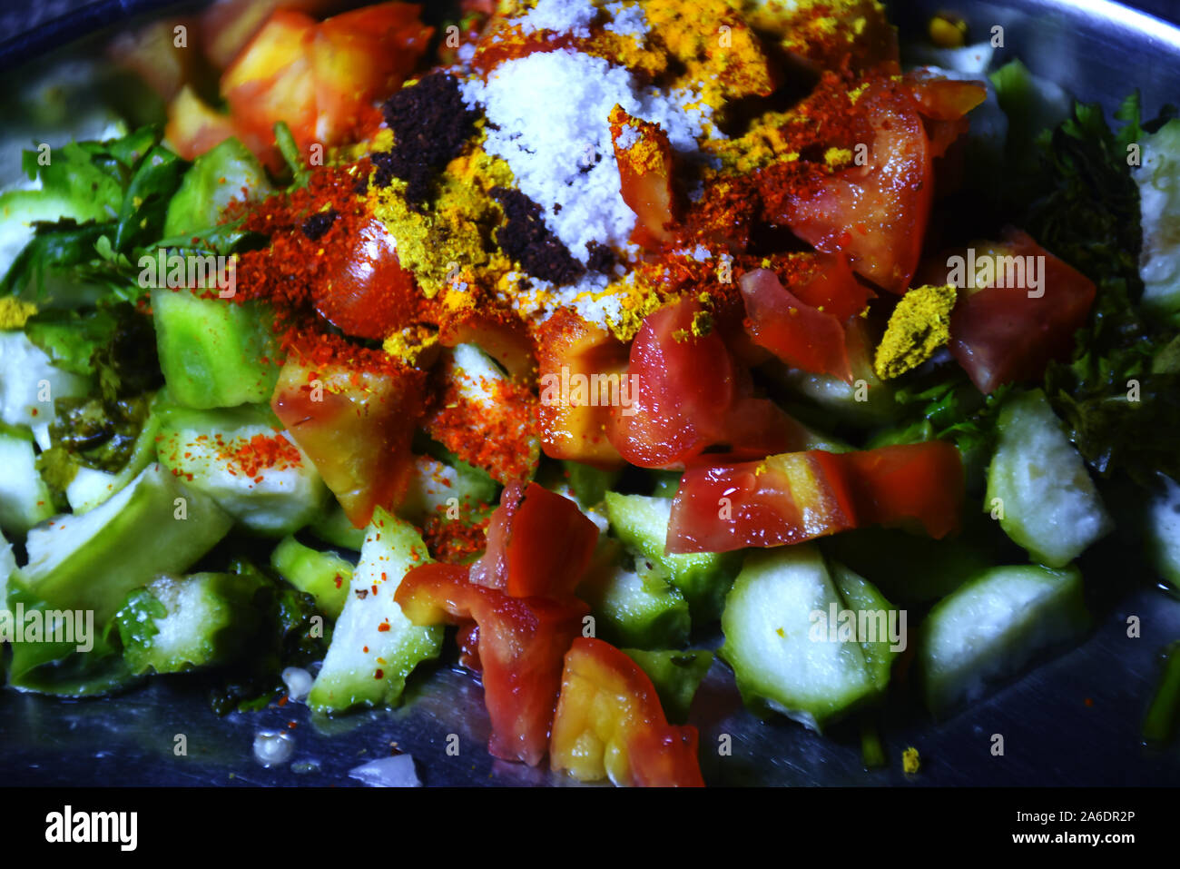 Fresh pieces of tomato and ram Turai (Sponge gourd) with coriander ...
