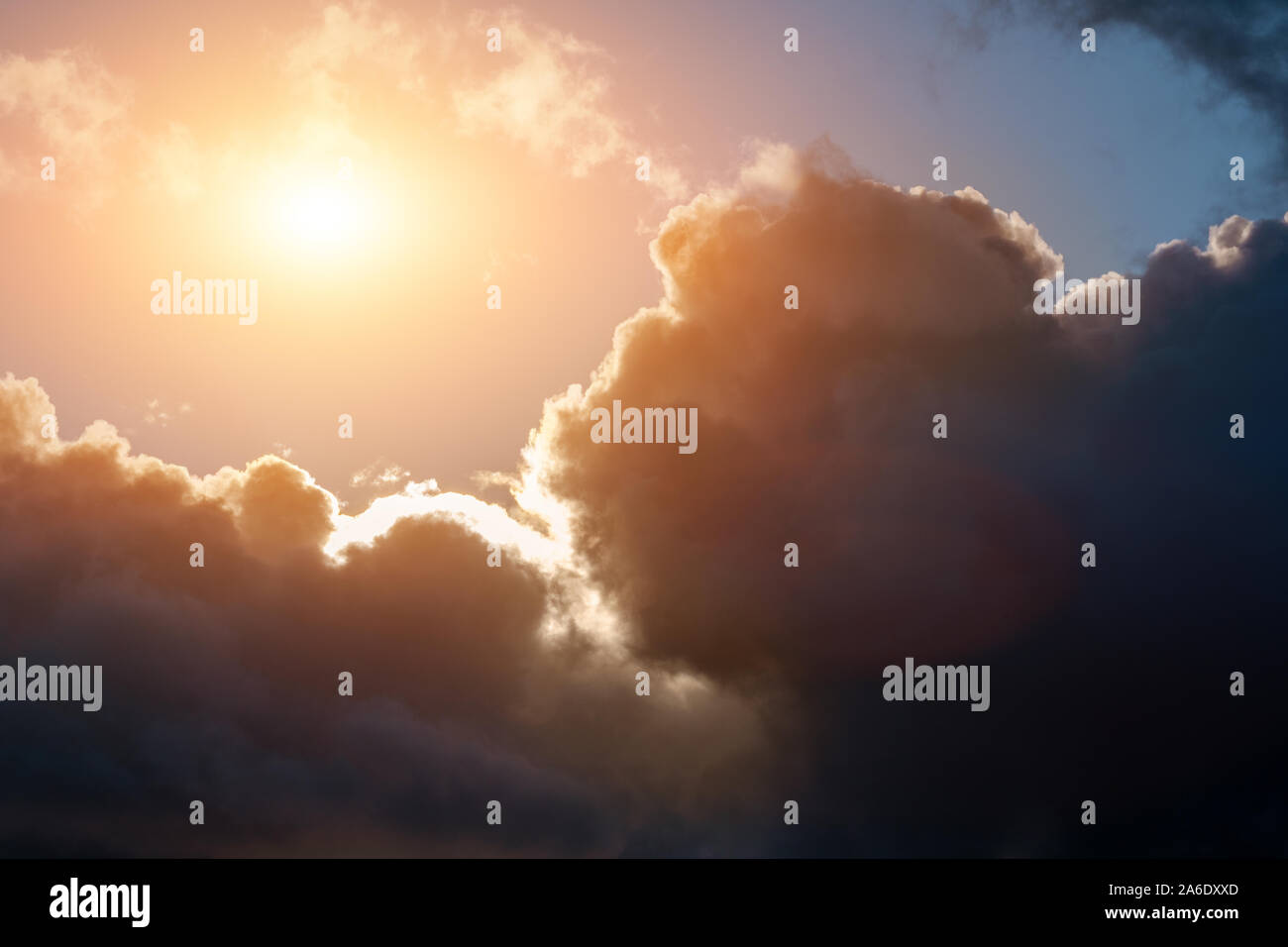 dramatic sky with rain clouds and sunlight Stock Photo - Alamy