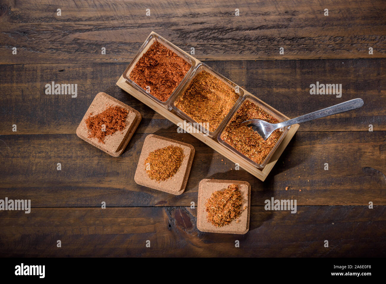 seasoning set on table with spoon and hand serving for cooking adding ...