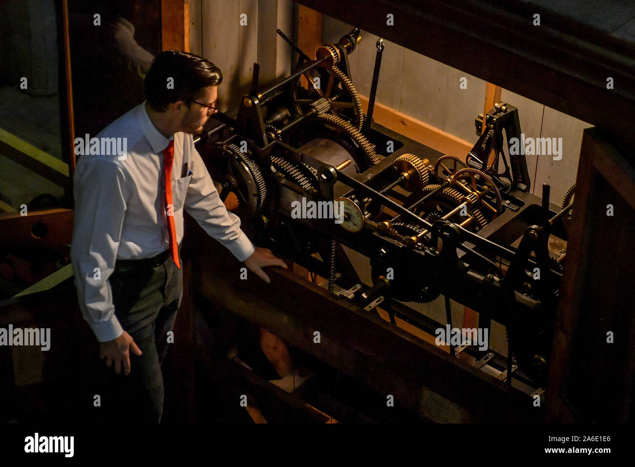 Salisbury Cathedral Verger Joseph Davies checks and adjusts the chiming ...