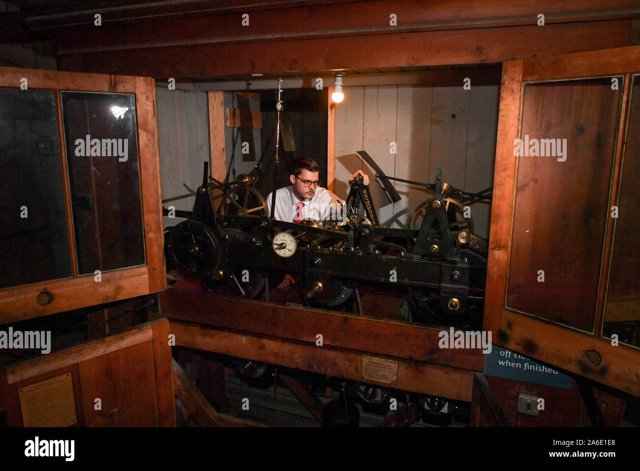 Salisbury cathedral verger joseph davies adjusts the chiming clock hi ...