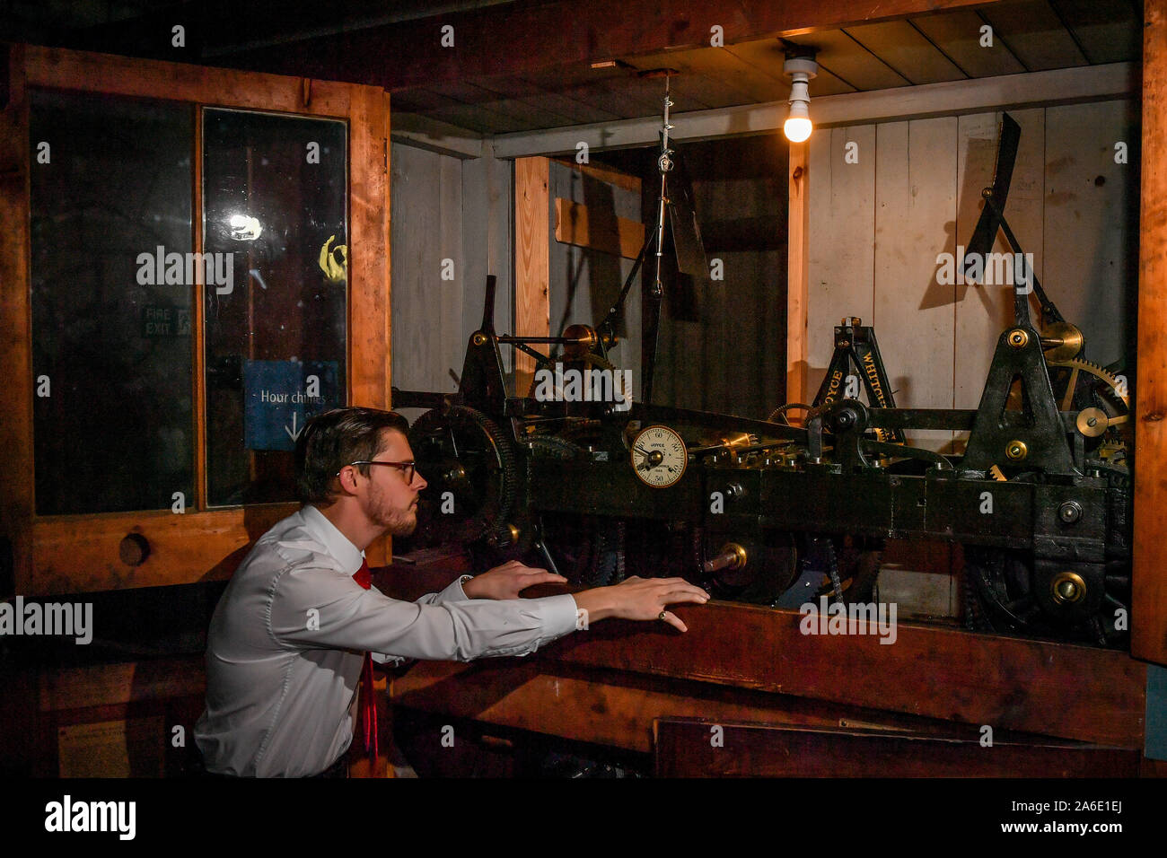 Salisbury cathedral verger joseph davies adjusts the chiming clock hi ...