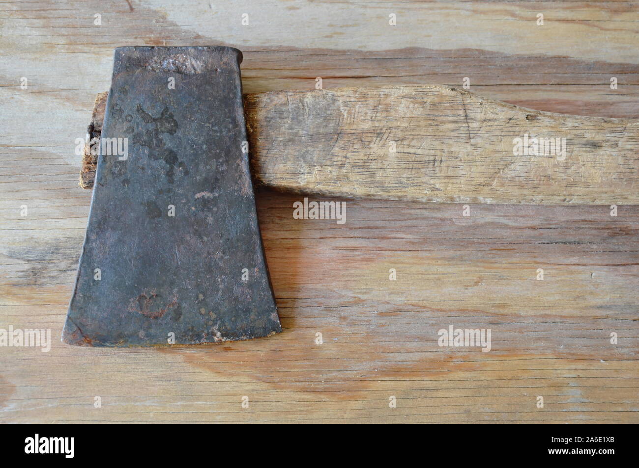 iron ax blade with wooden handle on plank Stock Photo - Alamy