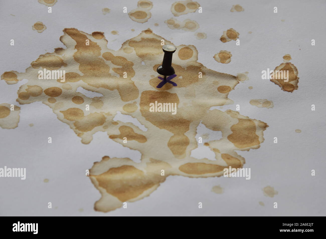 needle pin stab on old stained paper map Stock Photo - Alamy