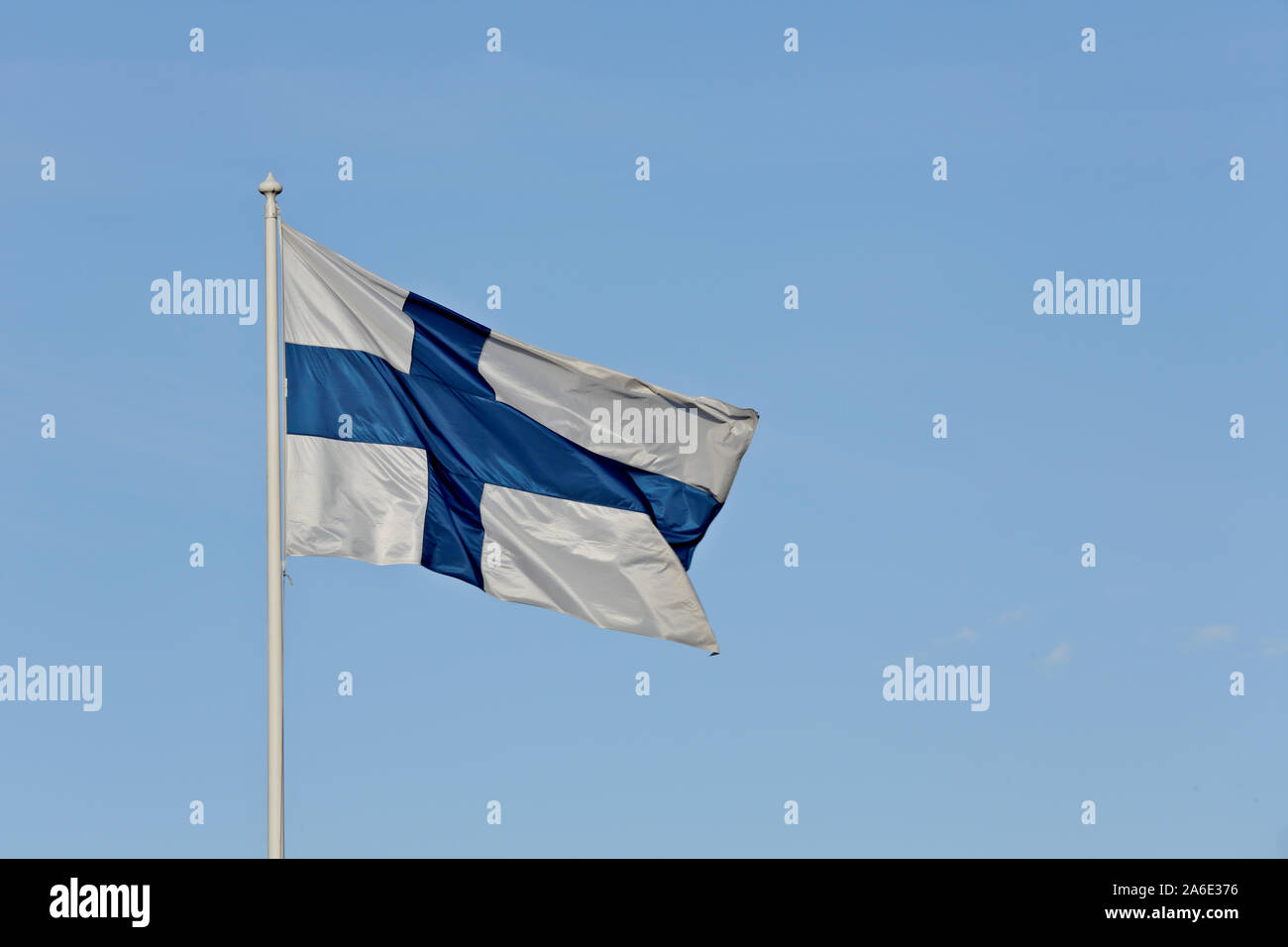 Finnish flag waving in the air against the blue sky Stock Photo - Alamy
