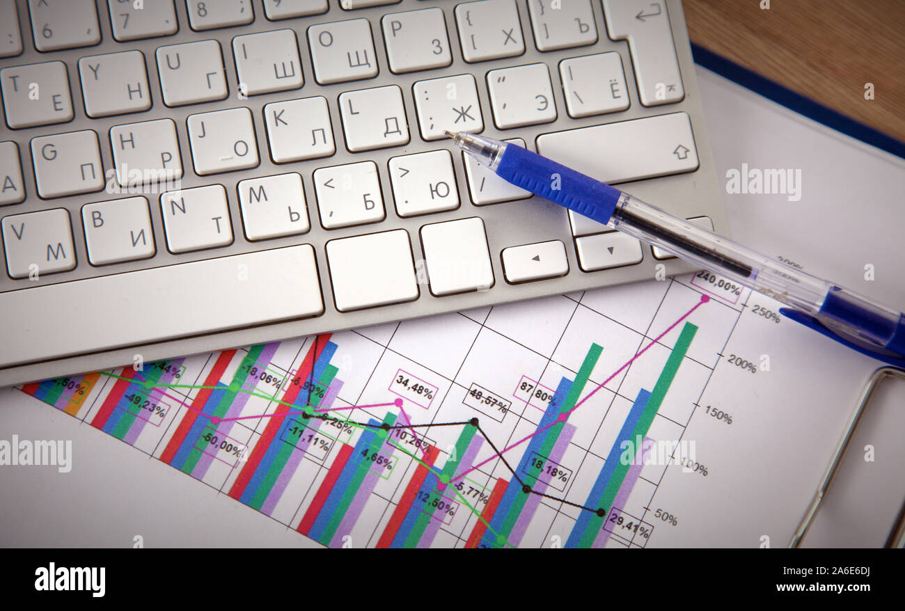 Office table with blank notepad and laptop Stock Photo - Alamy