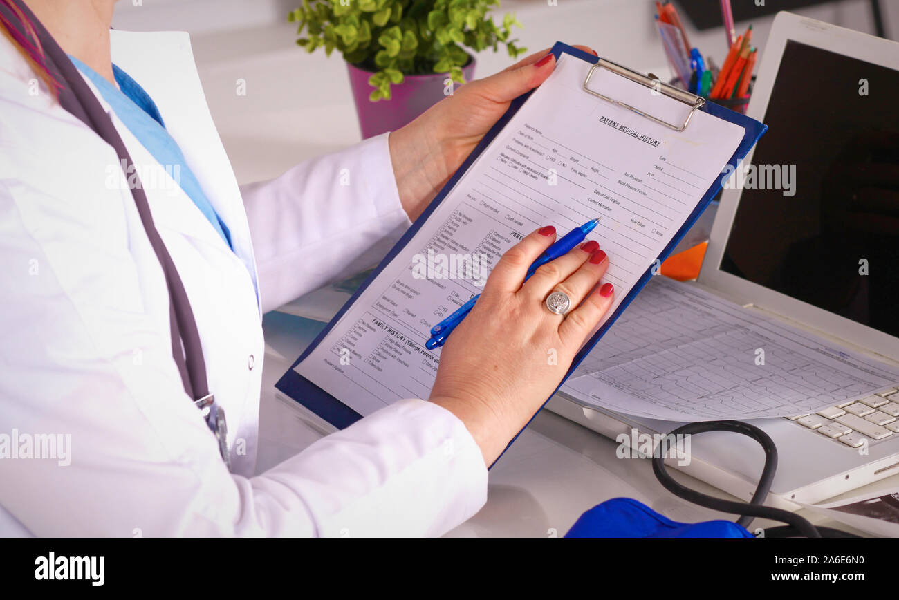 Female doctor at the desk in the office Stock Photo - Alamy