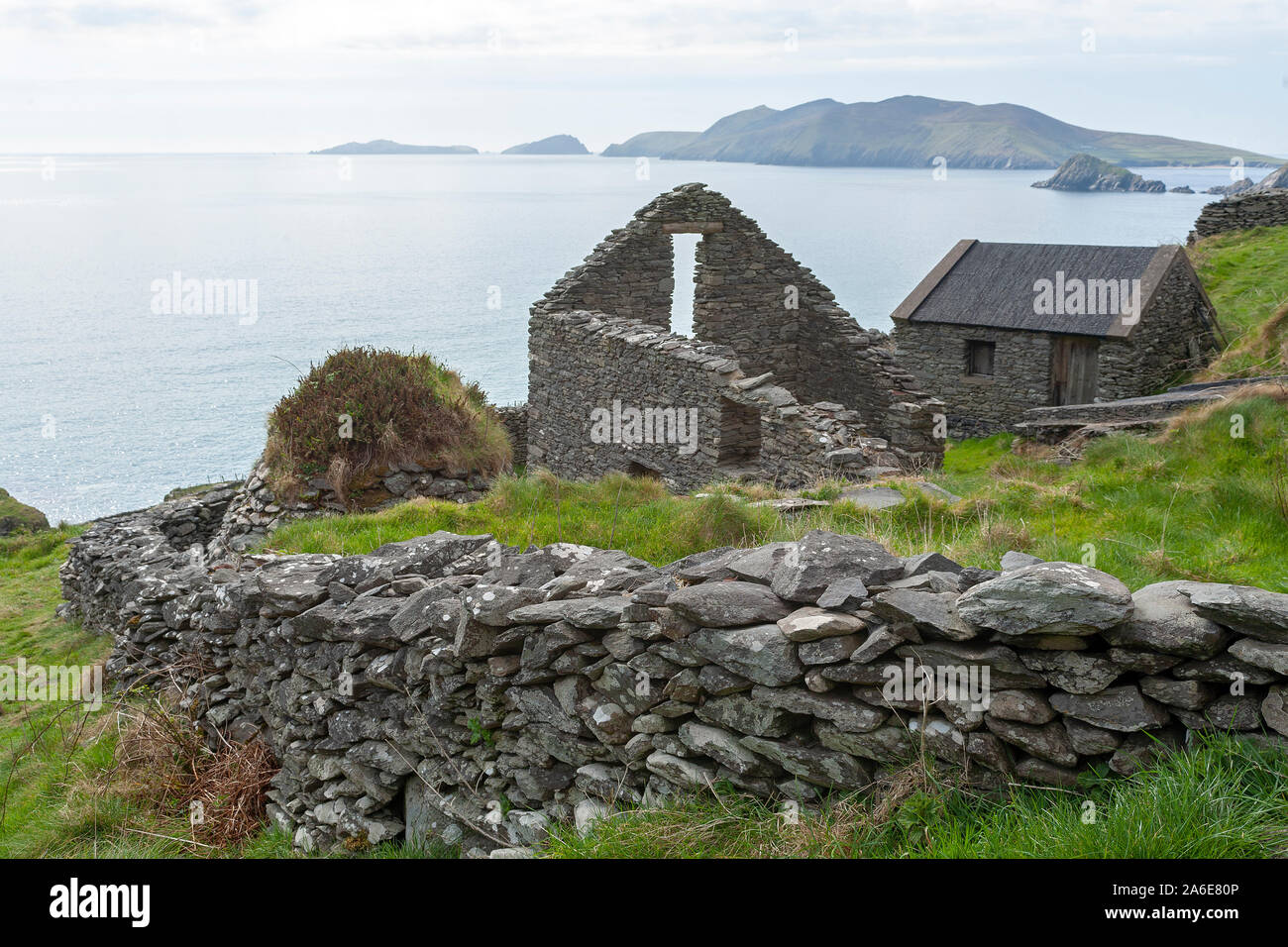 Ruins of a house near Slea Head and part of the Blasket Islands, the ...