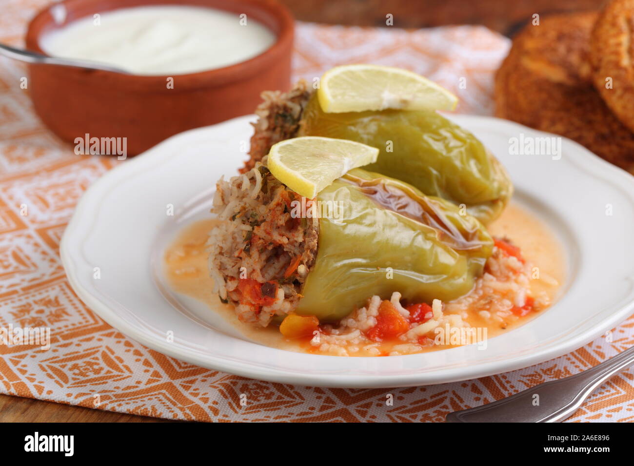 Turkish dish biber dolma, pepper stuffed with meat and rice and topped ...