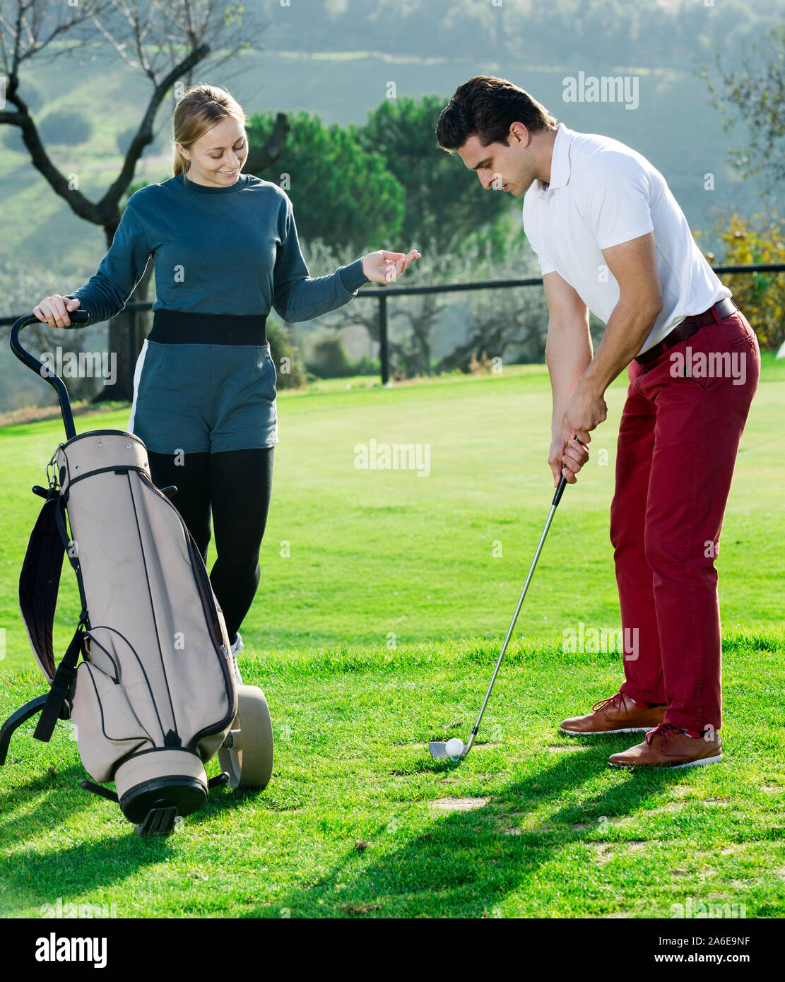 Glad golf partners playing tour of golf at golf course together Stock ...