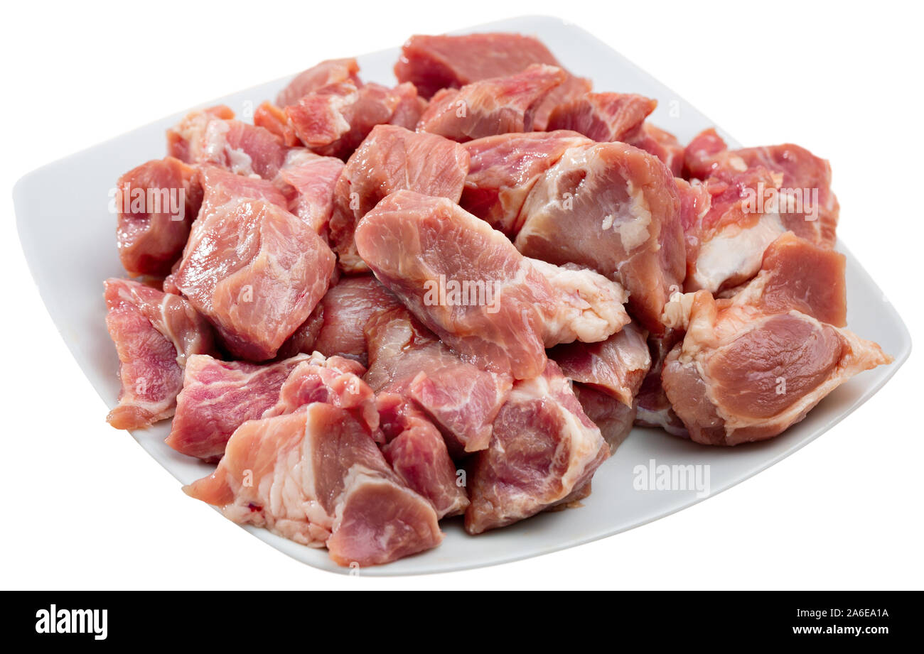 Raw chopped pork for stew. Isolated over white background Stock Photo ...