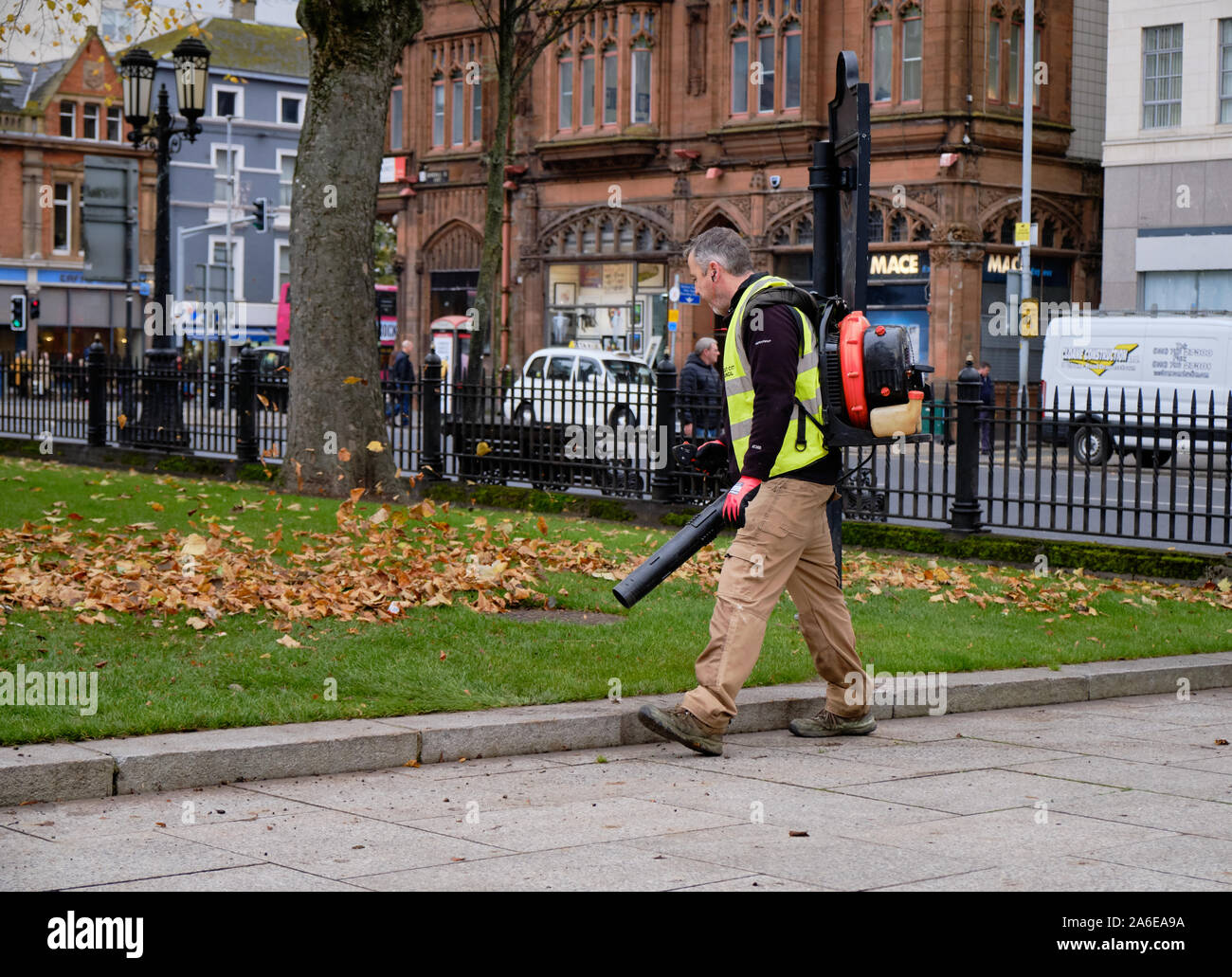Lawn maintenance at Belfast City Hall, with employee using a fuel ...