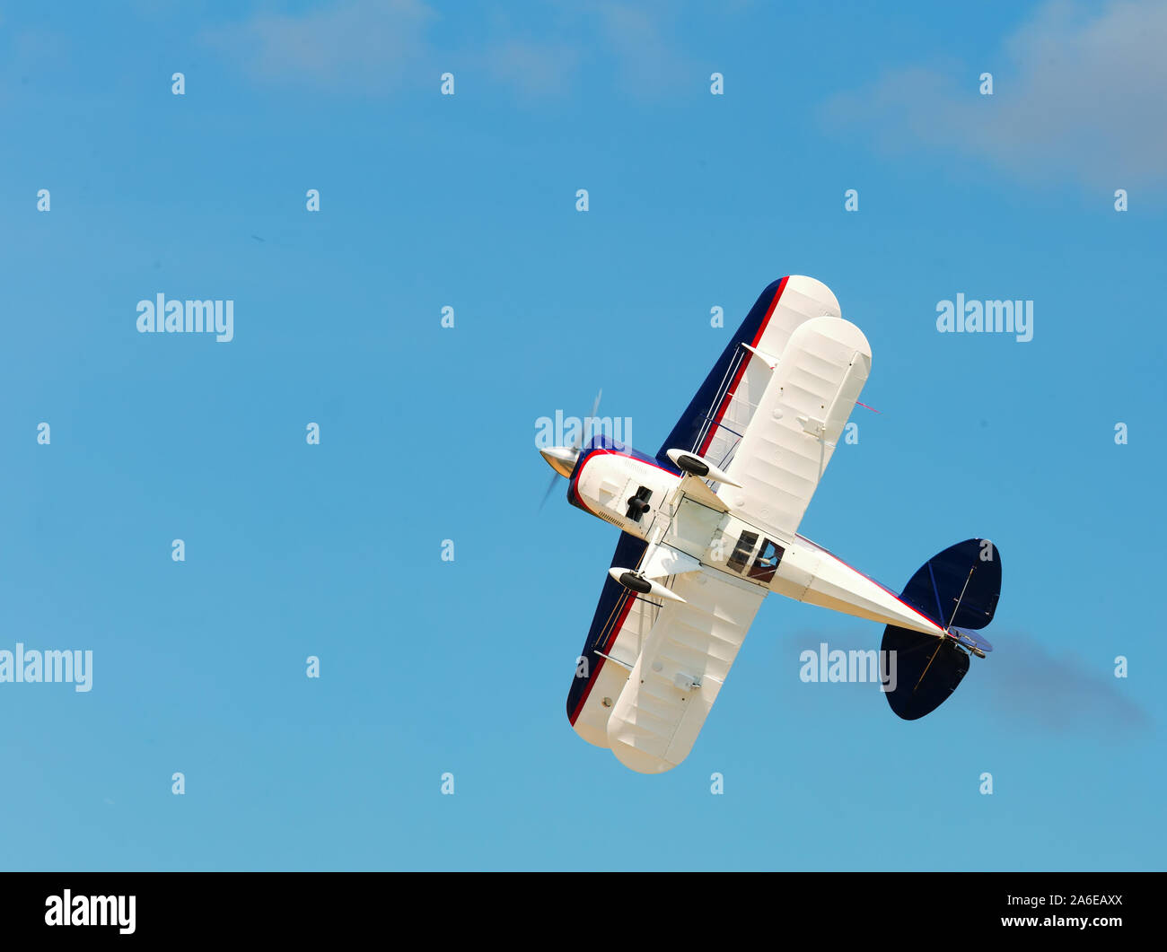 Light biplane demonstrating flying capabilities in sunny sky Stock ...