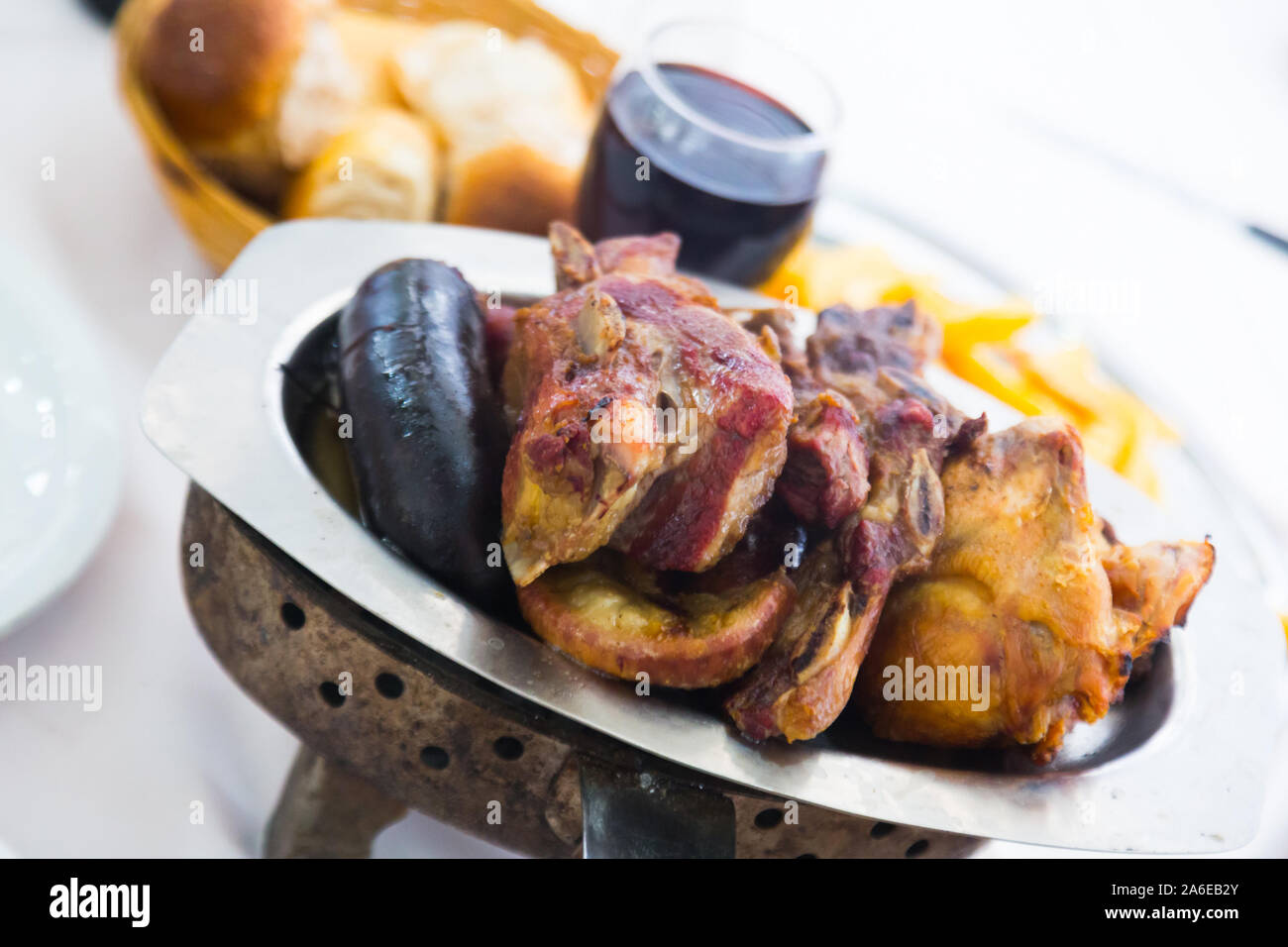 Traditional Argentinian dish asado served at dinner with wine Stock ...