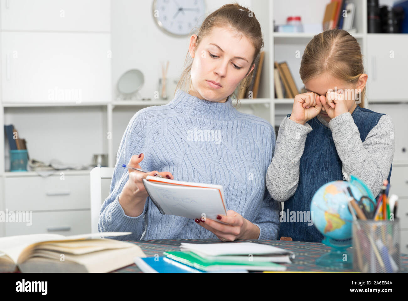 Mom scolds little daughter for poor grades in school Stock Photo - Alamy