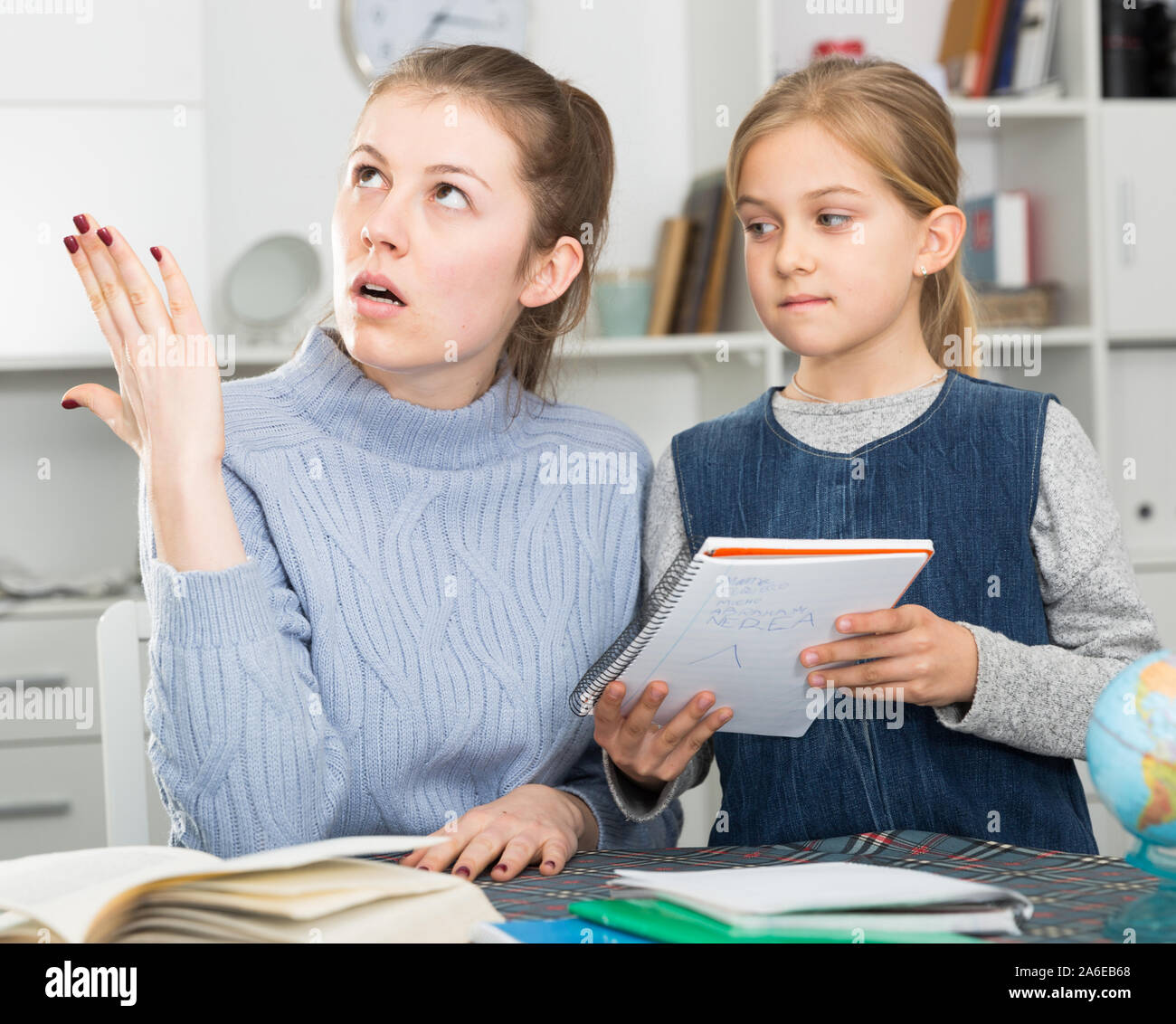 Mom scolds little daughter for poor grades in school Stock Photo - Alamy