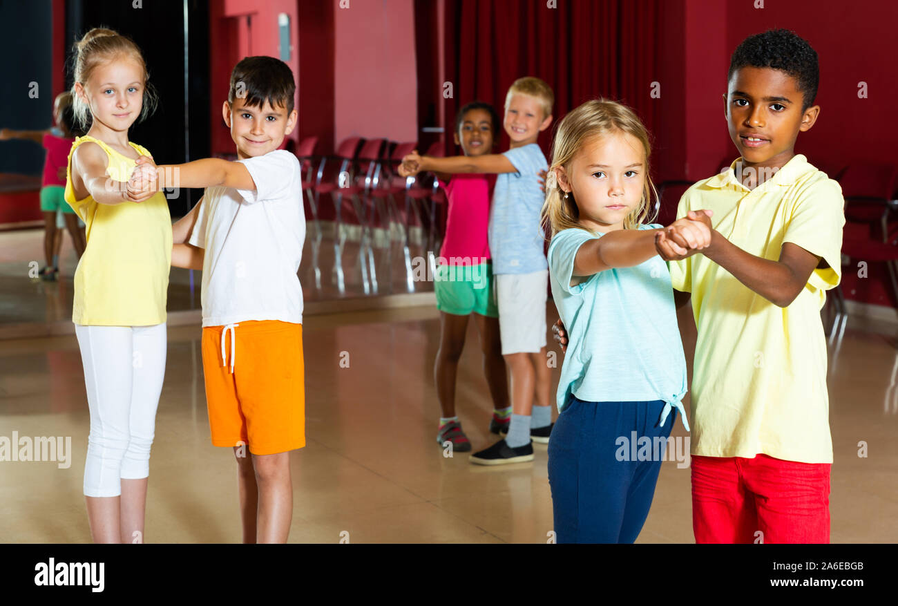 Group of children dancing salsa dance in modern studio Stock Photo - Alamy
