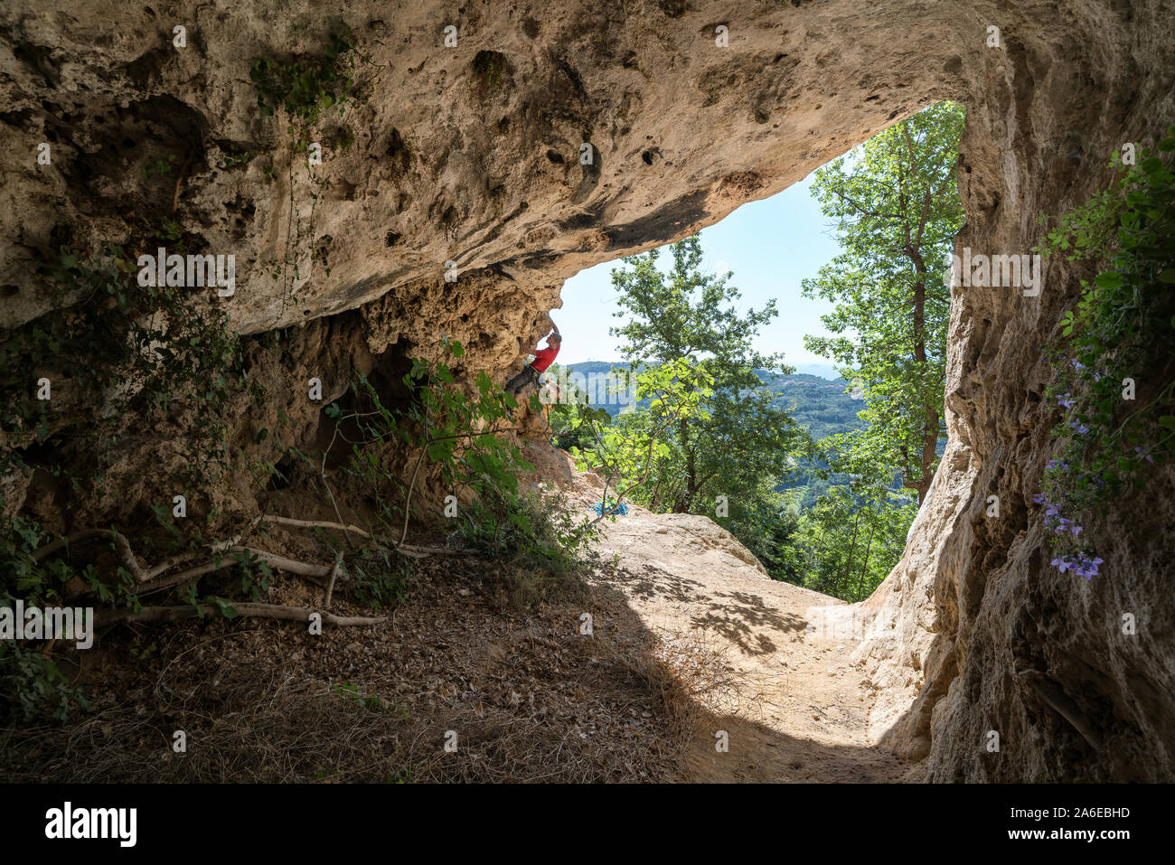 Rock climbing in a cave in Finale Ligure, Italy Stock Photo - Alamy