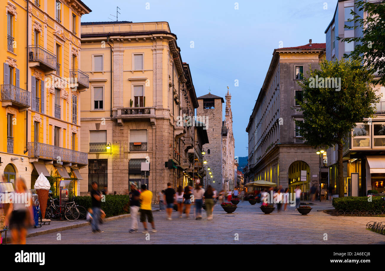 View of busy tourist street of Italian city of Como overlooking bell ...