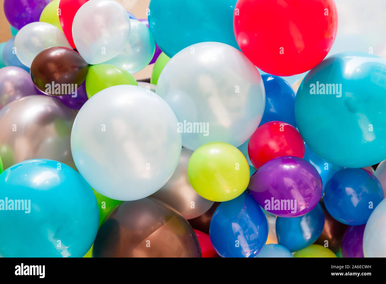 A bunch of multi-coloured balloons Stock Photo - Alamy