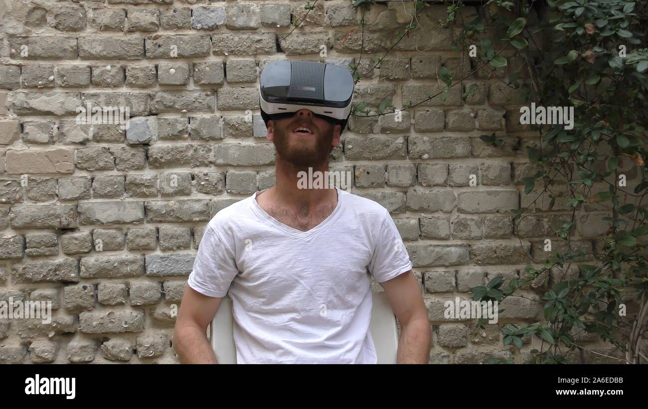 A man watches 360 degree video virtual reality using wearable head ...