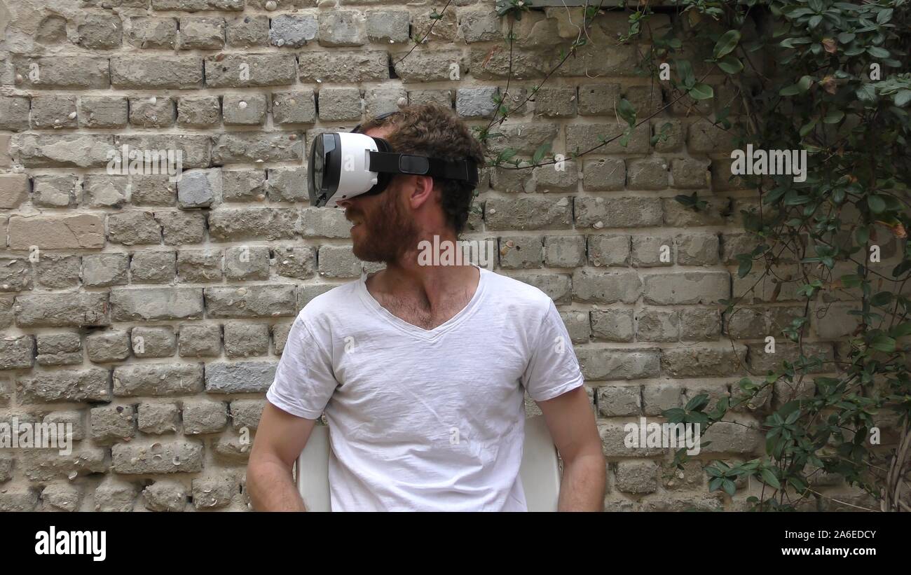 A man watches 360 degree video virtual reality using wearable head ...