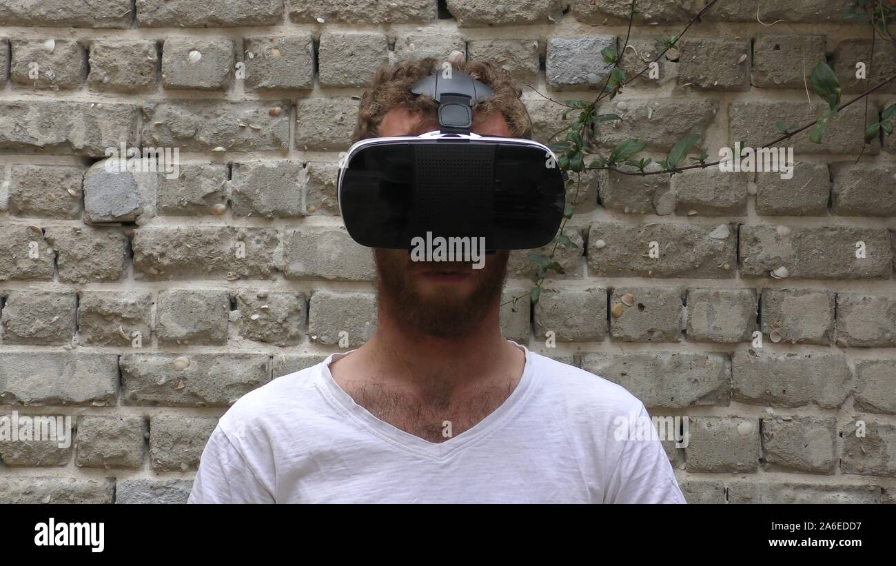 A man watches 360 degree video virtual reality using wearable head ...
