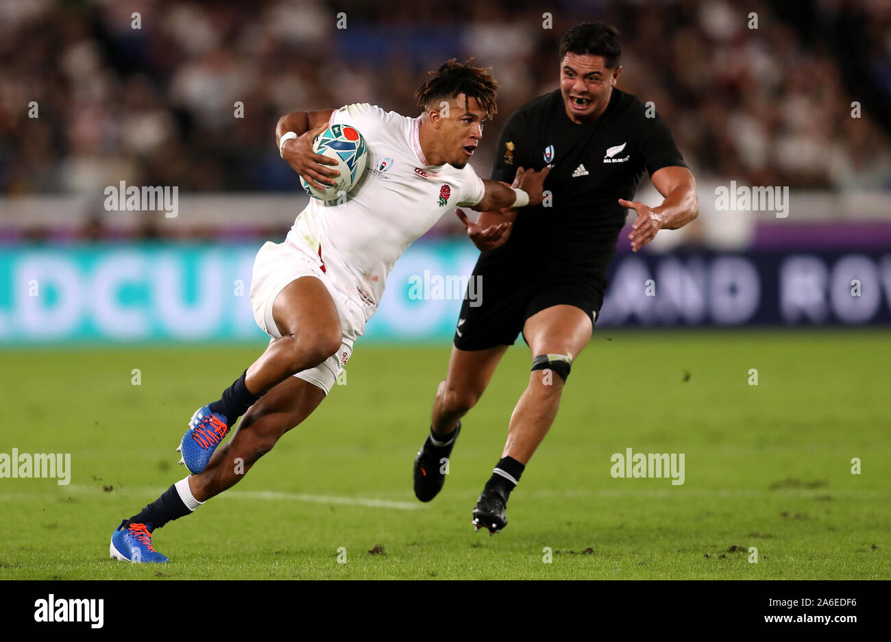 England's Anthony Watson hands off New Zealand's Anton Lienert-Brown ...