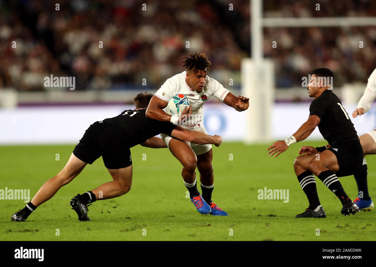 England's Anthony Watson is tackled by New Zealand's George Bridge ...