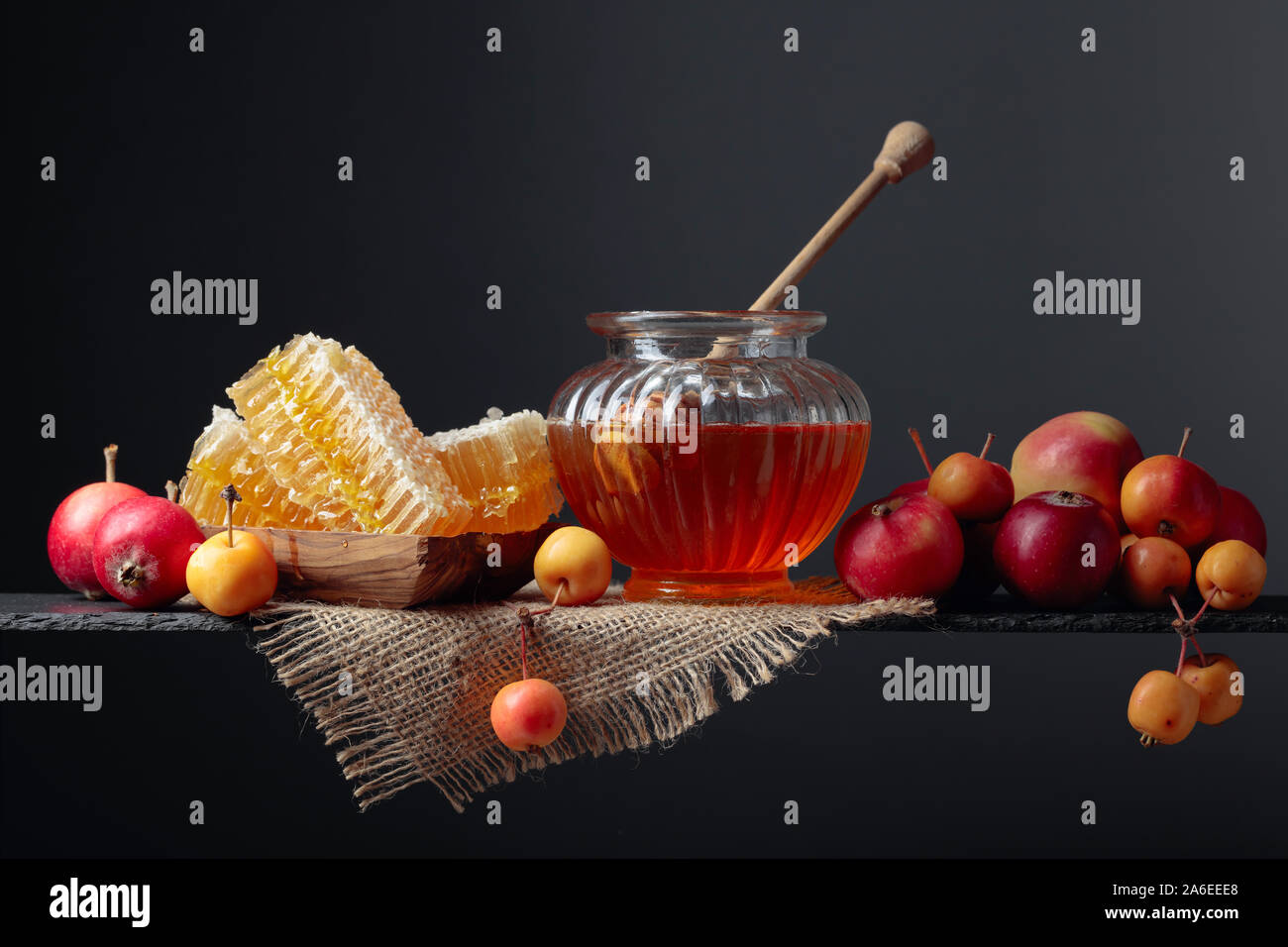 Honey and ripe small wild apples, healthy organic food Stock Photo - Alamy