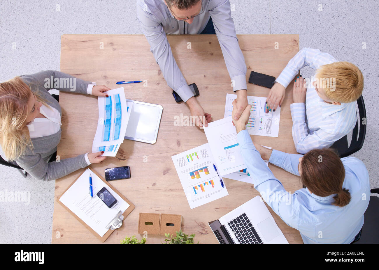 Business meeting - manager discussing work with his colleagues Stock ...