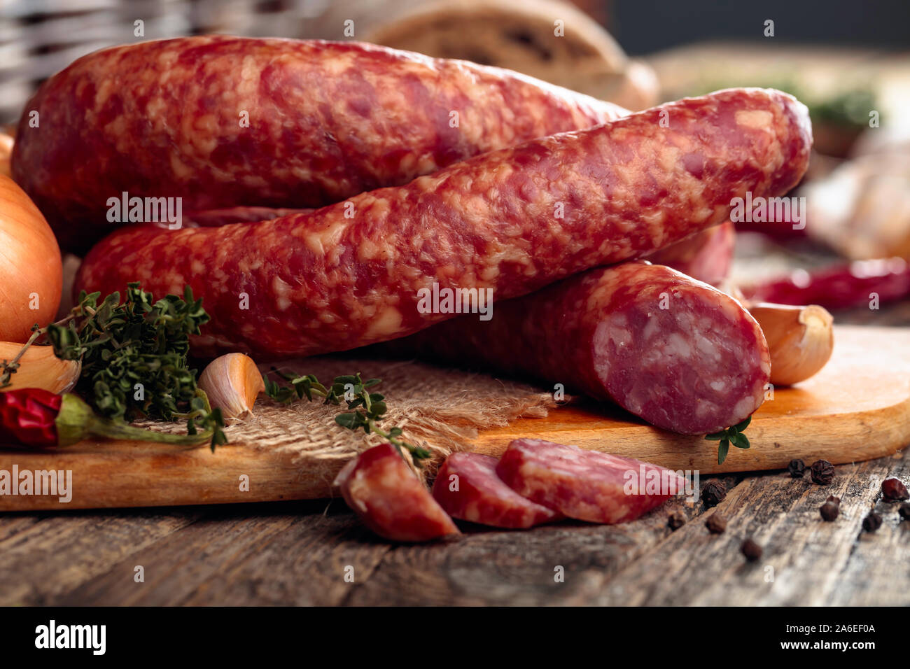 Dry-cured sausage with thyme, onion, garlic and pepper Stock Photo - Alamy