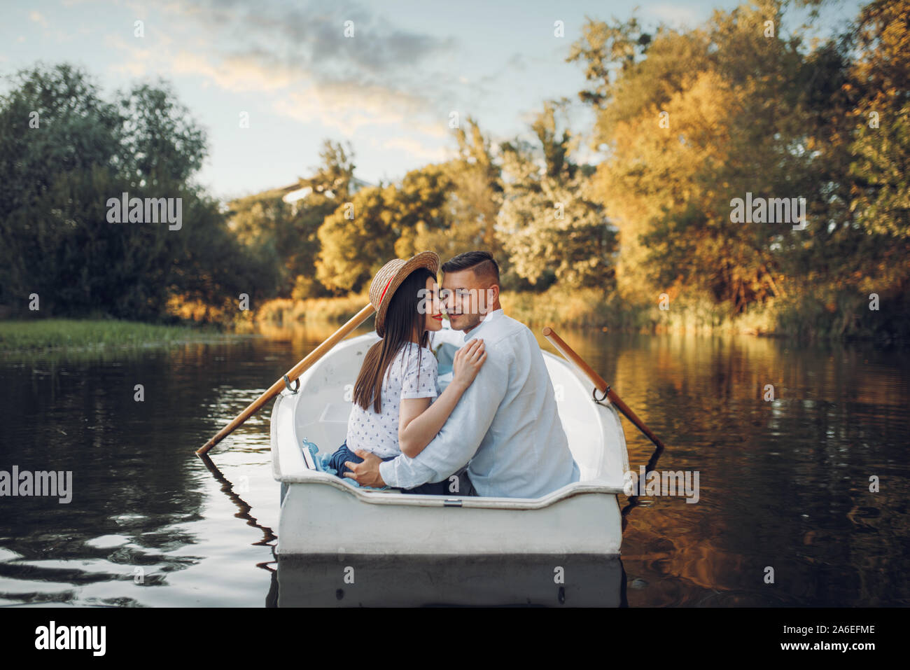 Happy love couple boating on lake, romantic date Stock Photo - Alamy
