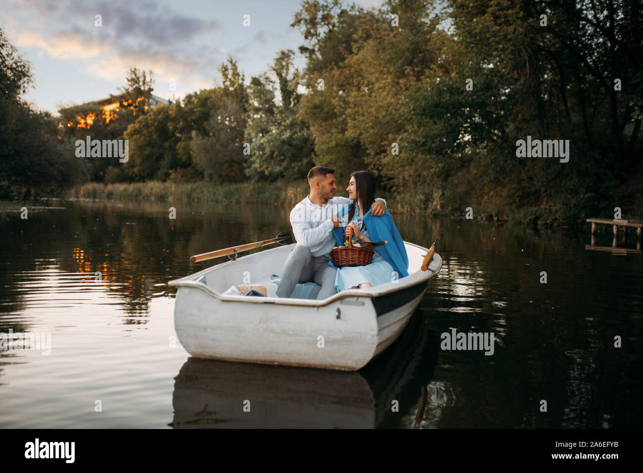Romantic couple water boat sunset hi-res stock photography and images ...