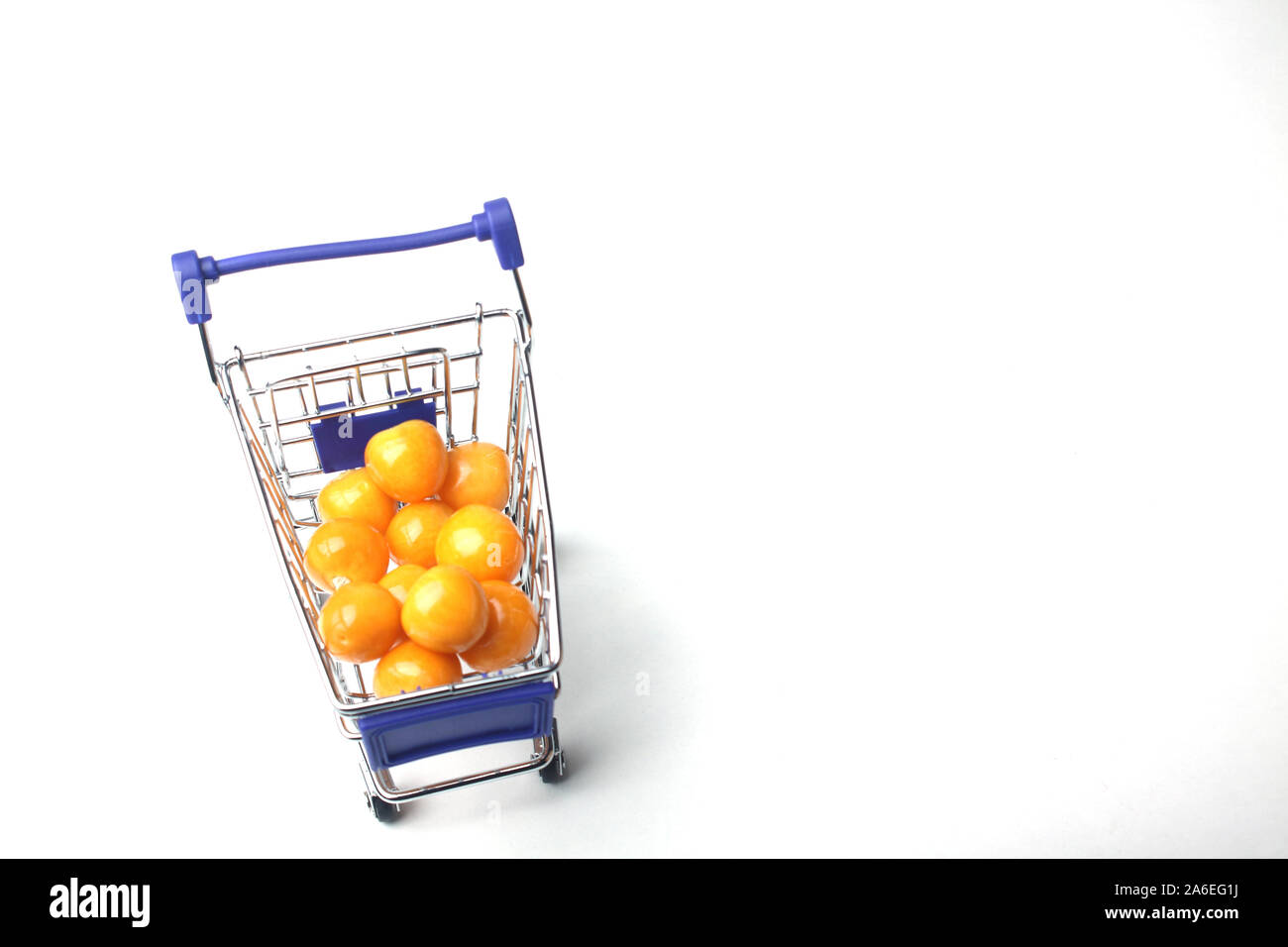 shopping cart with cape gooseberry on white background Stock Photo - Alamy