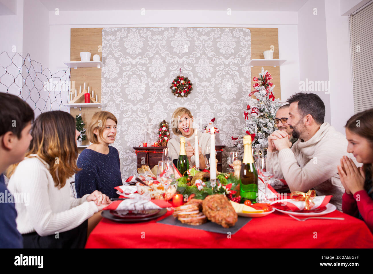 Beautiful family with children eating christmas dinner. Traditional ...