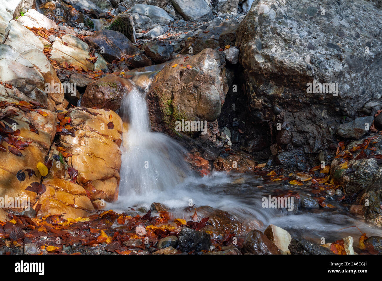 Small waterfall in a mountain gorge Stock Photo - Alamy