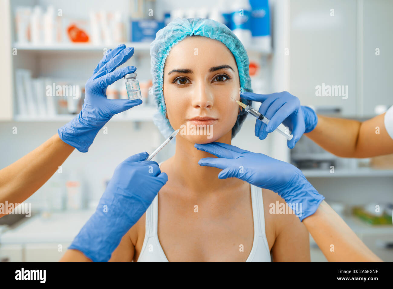 Cosmetician hands with botox and female patient Stock Photo - Alamy